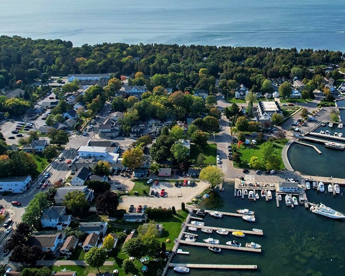 The aerial view reveals Fish Creek's perfect proportions – a human-scale town where nature still has the upper hand and water meets civilization on equal terms.