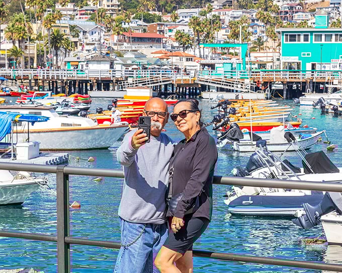 Visitors capture the perfect selfie against Avalon's postcard harbor—because some views are too good not to share (and make your friends jealous).