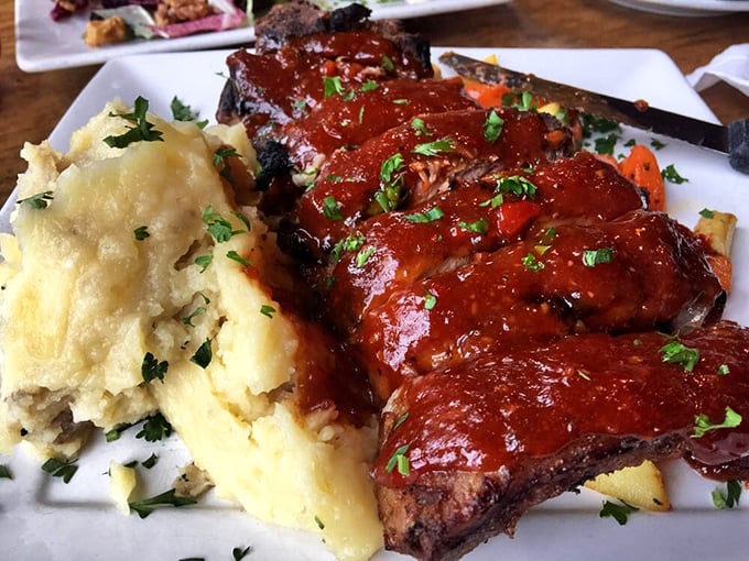 These ribs don't just fall off the bone – they practically leap onto your fork, glazed in a sauce that balances sweet, tangy, and smoky in perfect harmony.