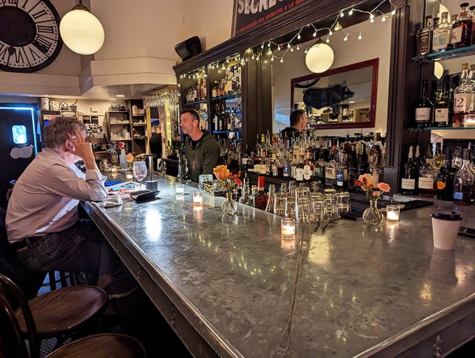 The bar—where spirits meet storytelling. That marble countertop has heard more confessions than a priest, all while mixing the perfect Manhattan.