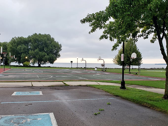 Bay View Park's basketball courts might be empty now, but imagine the pickup games with that Lake Huron backdrop—surely the most scenic free throws in Michigan.