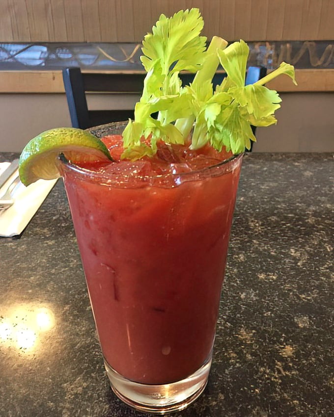 A Bloody Mary garnished with purpose, not just Instagram appeal—spicy, substantial, and ready to turn your morning around.