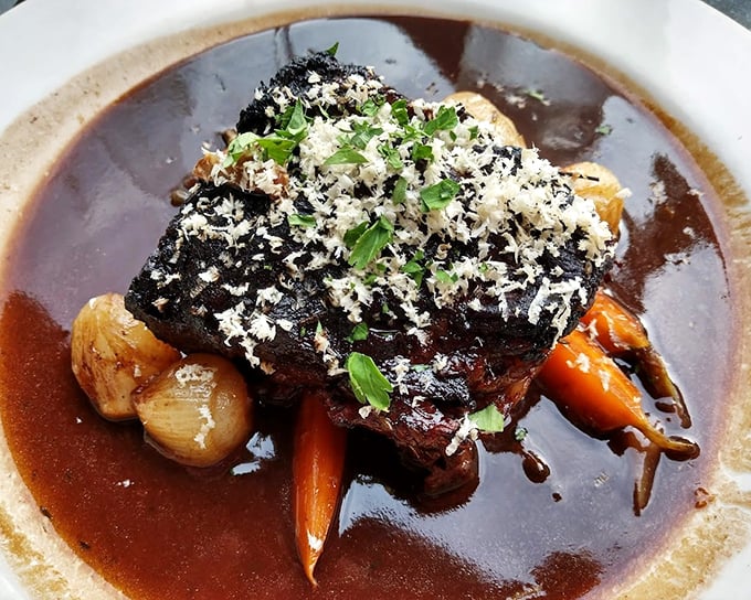 These braised short ribs aren't just falling off the bone – they're diving into that rich sauce with Olympic-worthy form.