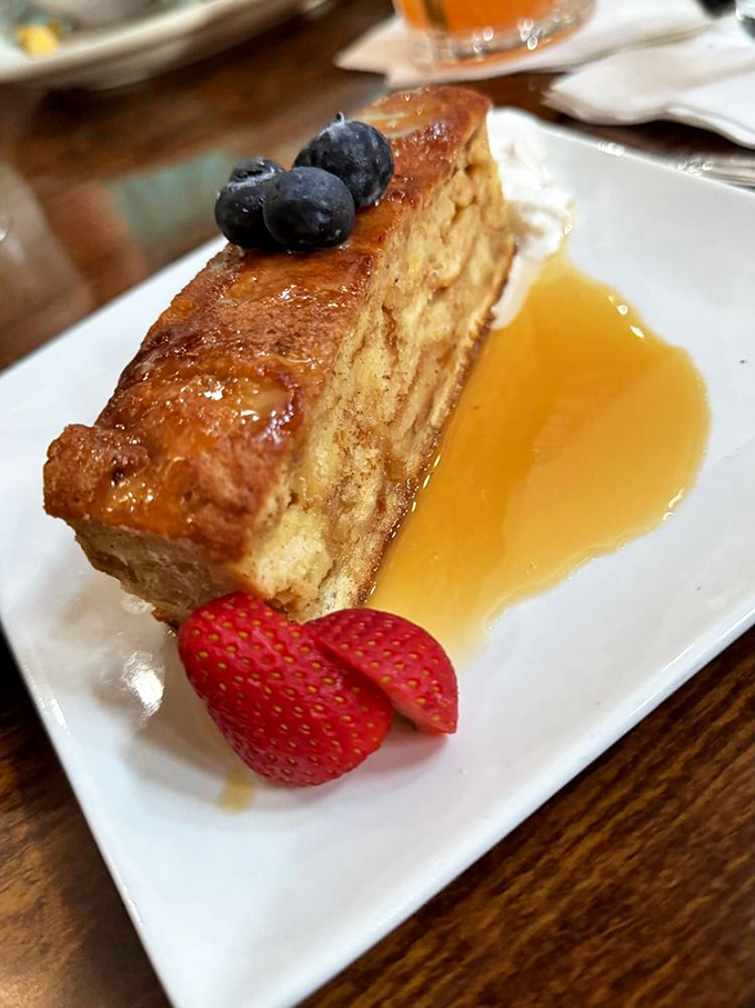 Bread pudding swimming in sauce like a delicious life raft – this is how you end a meal properly.