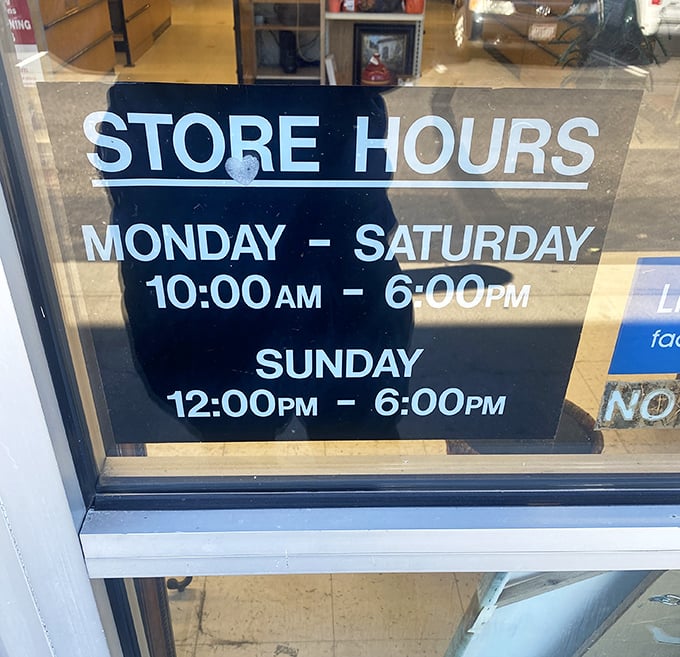 The store hours sign—memorize these numbers like lottery combinations if you want to strike secondhand gold in Fairfield.