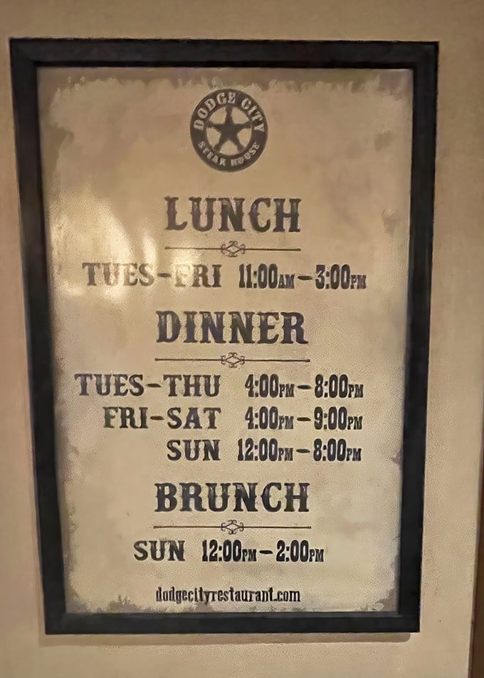 Business hours displayed with Old West typography—practical information delivered with thematic commitment that extends to every detail.