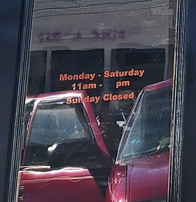 Even pizza artisans need a day off – those hours posted on the door are the fine print of food happiness planning.