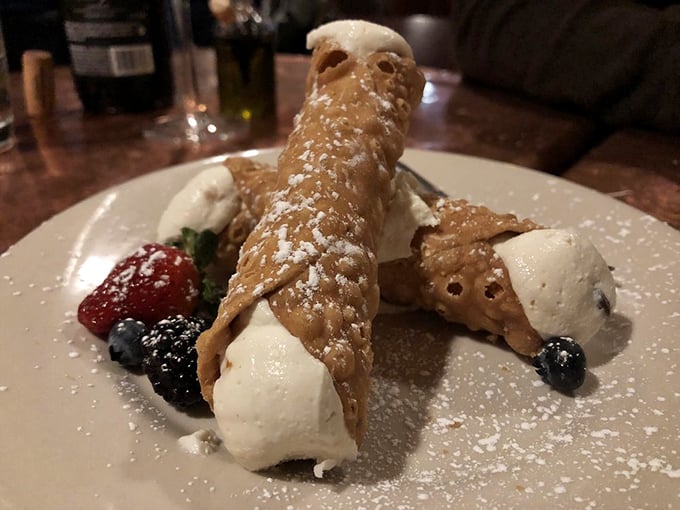 That cannoli is winking at you, stuffed with sweet ricotta dreams and dusted with powdered sugar promises.