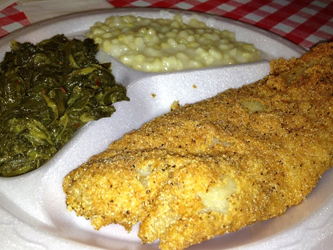 Cornmeal-crusted catfish with collard greens and creamed corn—a Southern trinity that proves heaven exists and it tastes like Tennessee.