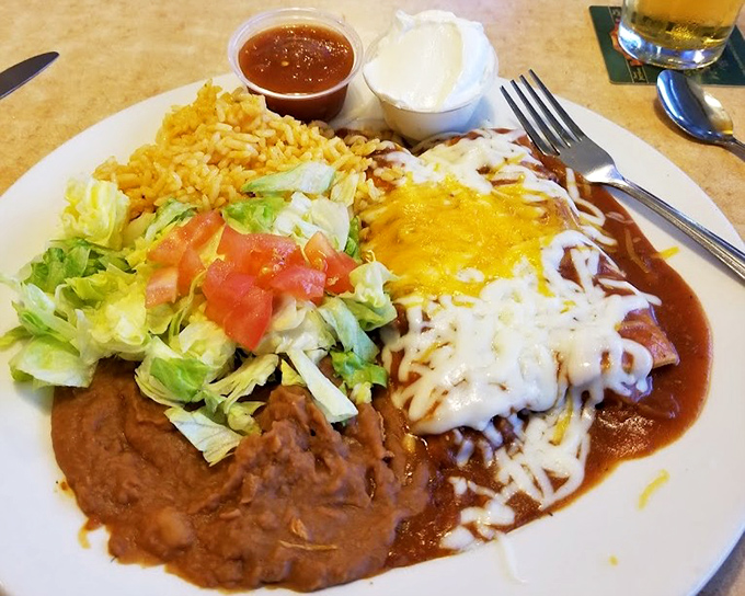 Enchiladas smothered in sauce and cheese – proof that sometimes the messiest foods make for the most memorable meals.
