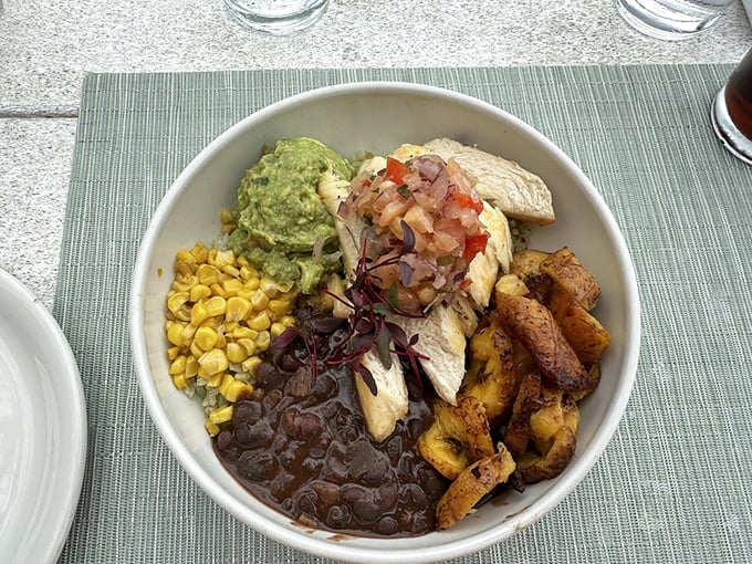 A bowl built for satisfaction—grilled chicken, black beans, sweet corn, and plantains create a Caribbean-inspired flavor fiesta.