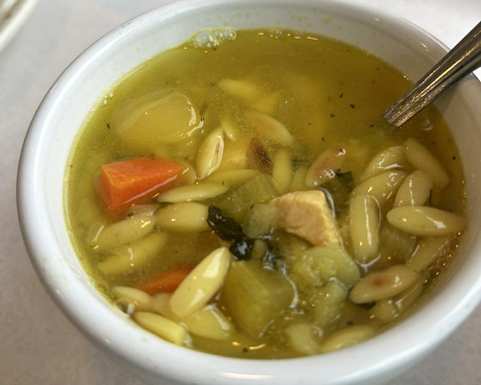 Chicken orzo soup that proves comfort doesn't need to be complicated—just honest ingredients swimming in harmony in a broth that tastes like someone's grandmother made it.