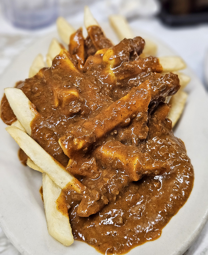Chili fries that don't mess around—a foundation of crispy potatoes supporting a lavish pour of meaty chili that demands both fork and commitment.