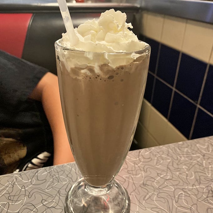 This isn't just a chocolate milkshake – it's a tower of dairy magnificence that demands respect and a sturdy straw.