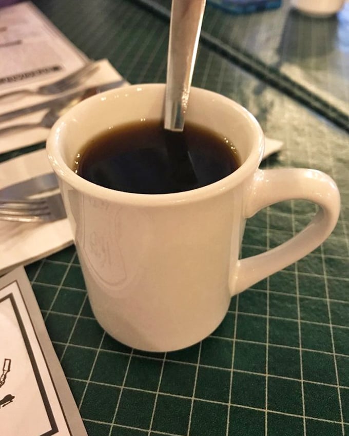 The humble coffee mug—unassuming vessel of morning salvation. In diners like this, refills aren't just offered, they're practically mandatory.