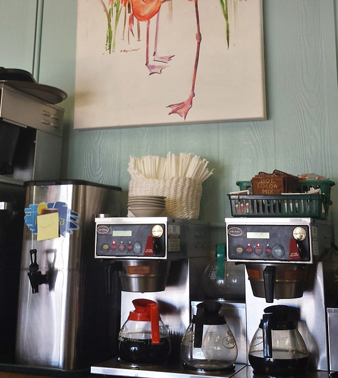 Coffee station with a flamingo painting above—because caffeine tastes better when served with a side of Florida whimsy.