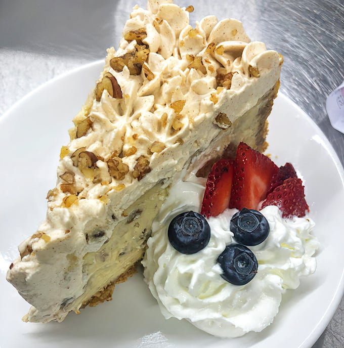 This isn't just dessert, it's architecture – layers of cream, cake, and nuts creating a masterpiece that makes calorie-counting seem like a crime against joy.