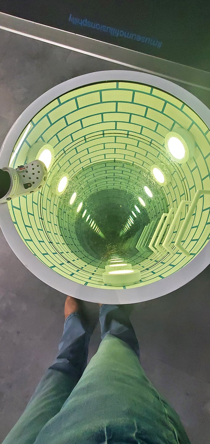 "I'm pretty sure this well doesn't actually go to China." The floor illusion creates a dizzying sense of depth that makes crossing the room an act of bravery.