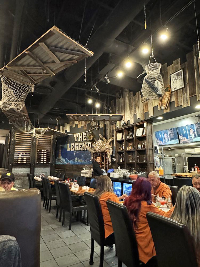 Diners lost in seafood bliss beneath fishing nets and weathered wood. The true Vegas jackpot isn't found at a slot machine—it's served on these plates.