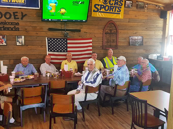 The regulars' table – where stories are swapped, BBQ is savored, and friendships are smoked to perfection over decades.
