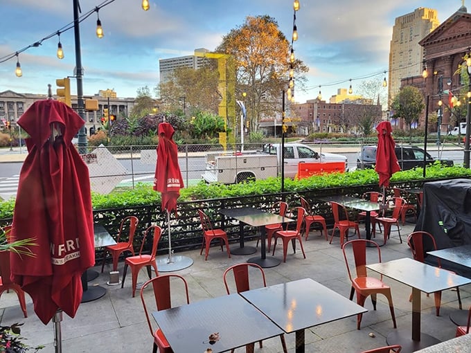 Al fresco dining with a view of Logan Square – where red umbrellas stand at attention, ready to shield your perfect meal from anything but pleasure.