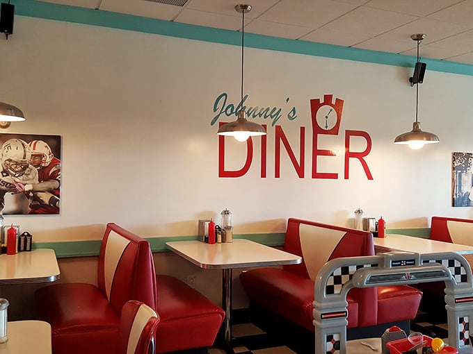 Red vinyl booths aren't just seating – they're time machines to when conversations happened face-to-face and phones were just for calling.