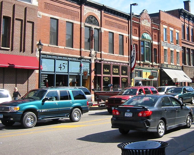 Downtown Stillwater buzzes with pedestrians crossing at Nelson Street—a scene that belongs equally in a tourism brochure or a Norman Rockwell painting.
