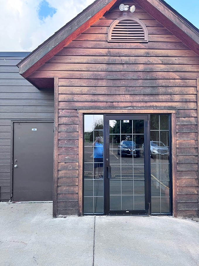 An entrance that doesn't need to shout to be noticed. That wooden doorway isn't just an entry point—it's a portal to comfort food nirvana.