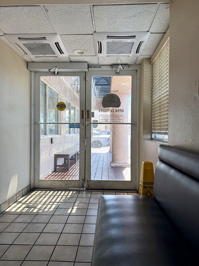 The entrance—a portal to a parallel universe where calories don't count and coffee refills flow like the Bellagio fountains.