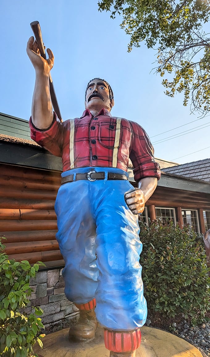 This Paul Bunyan statue isn't just tall – he's looking at your plate to make sure you finish those hash browns.