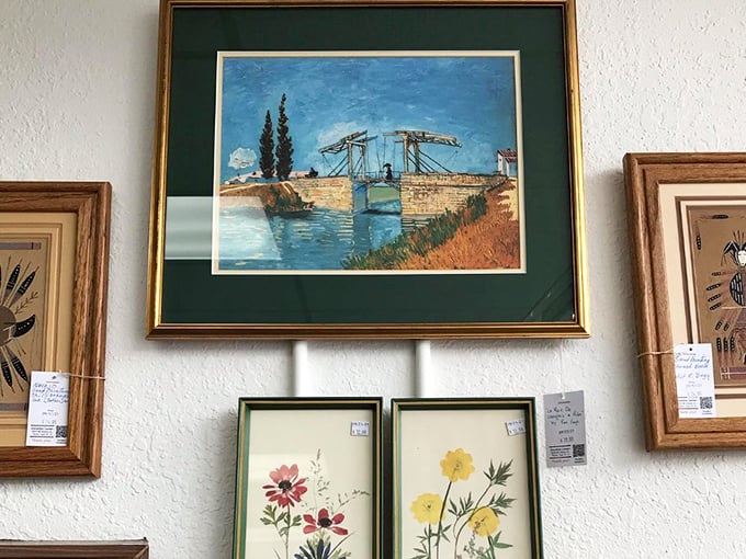 Van Gogh's bridge at Arles watches over botanical prints below. Quality frames alone would cost more than these complete wall-ready treasures.