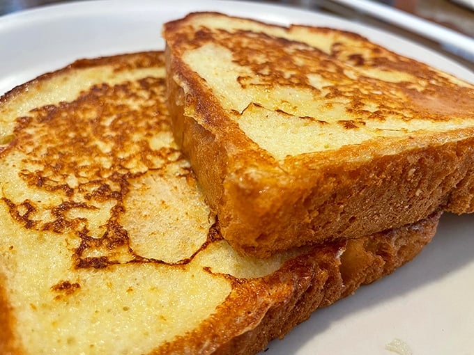 French toast that makes you wonder why anyone would eat anything else for breakfast. That golden crust hides a custardy interior that's pure morning bliss.