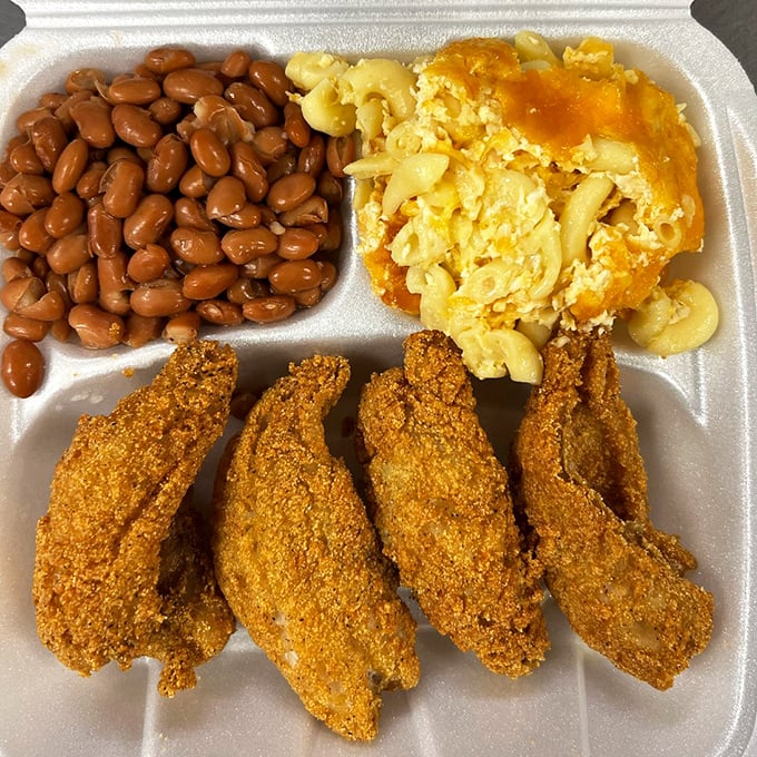 Golden-fried ocean perch with mac and cheese and baked beans—the kind of meal that makes you want to hug the chef and never let go.