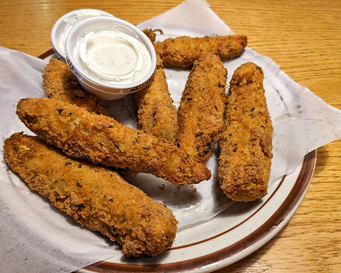 Fried pickles—proof that sometimes the best culinary ideas sound questionable until that first addictive, tangy-crunchy bite changes everything.