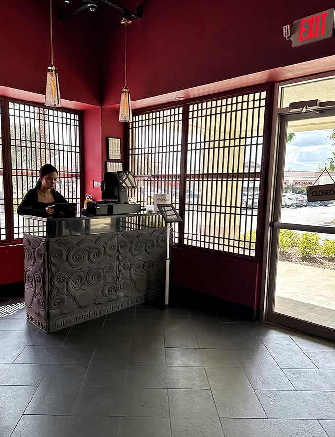 The hostess station marks the threshold between ordinary day and extraordinary meal – your passport control to flavor country.