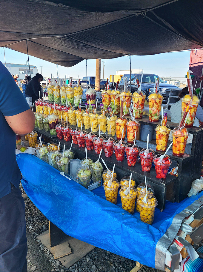 Fruit cups that put office vending machines to shame—nature's candy, dressed for success with chile, lime, and the promise of refreshment.