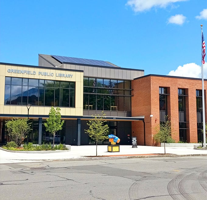 The modern Greenfield Public Library blends contemporary design with traditional brick—because even in the digital age, nothing beats browsing actual bookshelves.