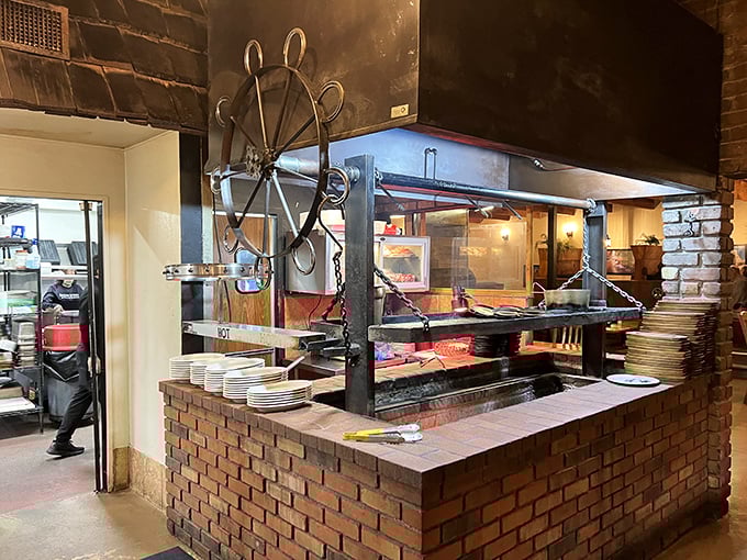 Where the magic happens – an open kitchen where flames kiss meat in a timeless ritual of transformation.