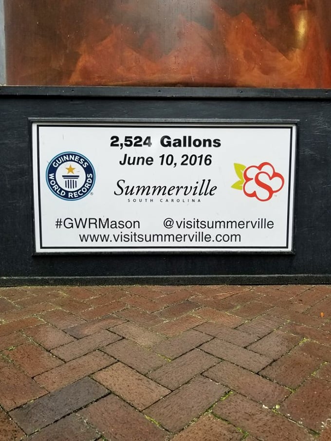 The official Guinness World Record plaque confirms what your eyes can't believe—2,524 gallons of actual sweet tea made history here. 