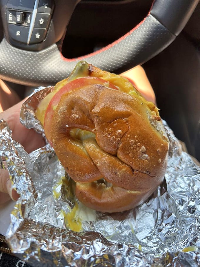 Car dashboard dining at its finest—this pretzel sandwich proves some treasures are too good to wait until you get home.