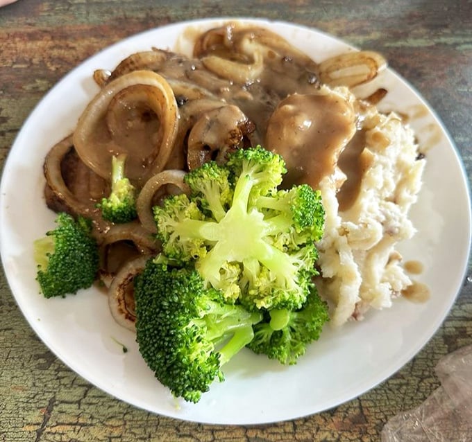Liver and onions – that divisive classic – prepared with such care that even skeptics might be converted to this old-school comfort food's rich, savory charms.