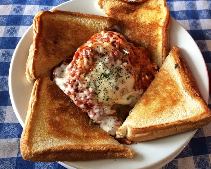 Lasagna surrounded by perfectly toasted bread—the Italian-American dream team. This isn't just lunch; it's a warm hug disguised as pasta.
