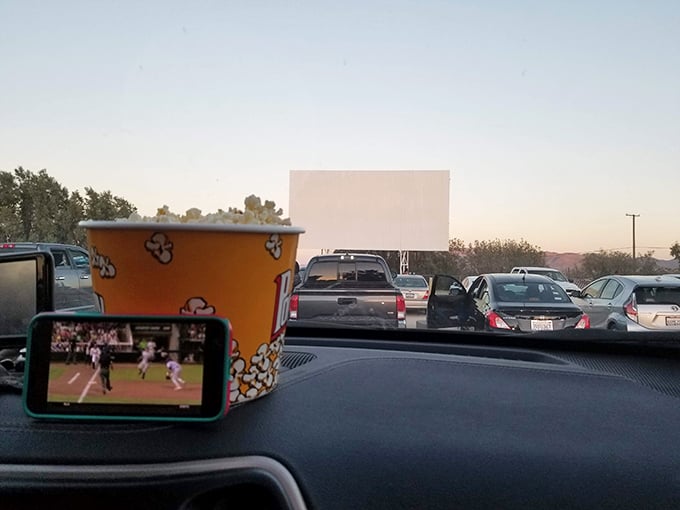Modern technology meets vintage experience—watching one screen while scrolling on another is the new normal.