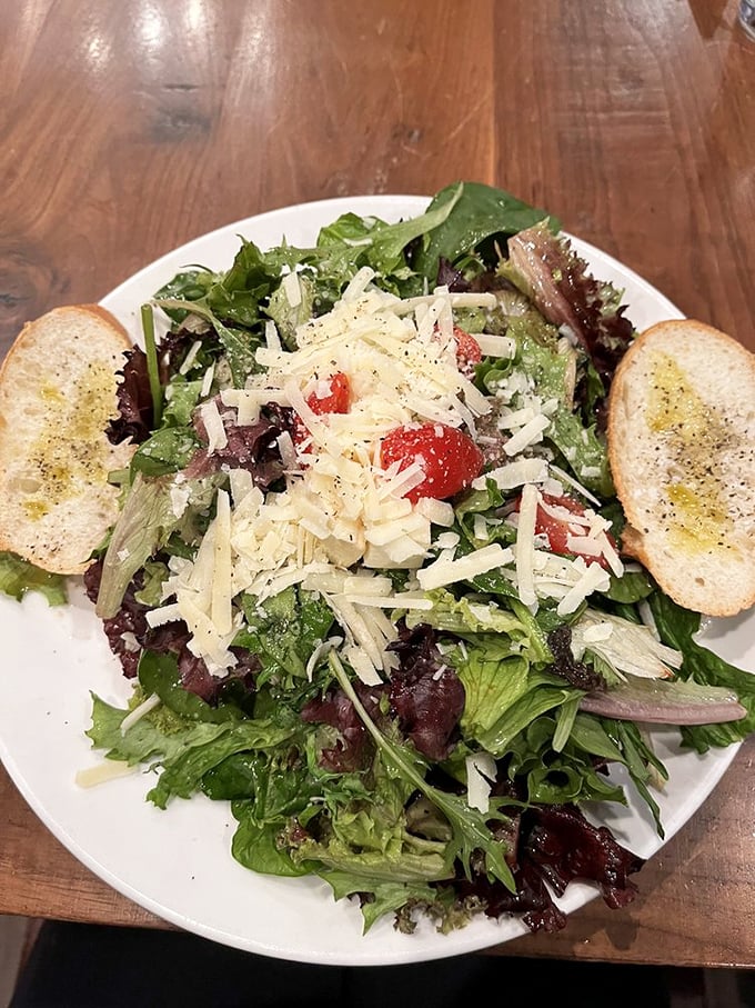 A house salad that refuses to be boring. Those shavings of Parmesan aren't garnish—they're little flavor treasures waiting to be discovered.