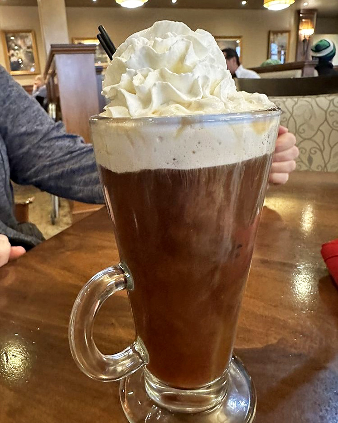 Irish coffee topped with a cloud of whipped cream—where "I shouldn't have dessert" meets "but it has coffee in it."