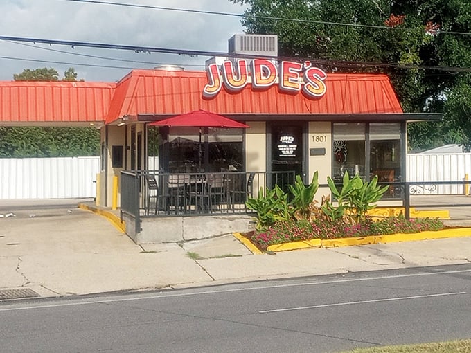Jude's bright orange roof signals what locals already know—this is where comfort food meets Louisiana soul.