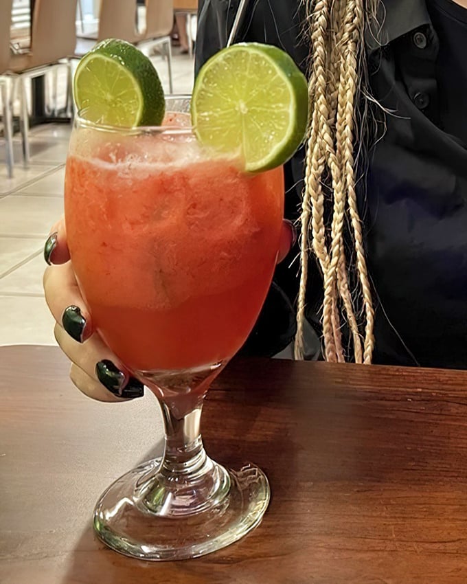 That vibrant juice with lime garnish isn't just refreshing – it's Florida sunshine in liquid form.