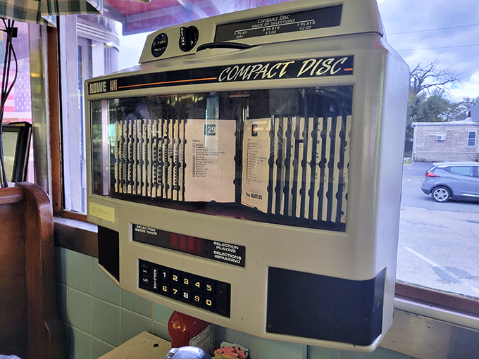 The vintage jukebox stands as a musical time machine, offering three minutes of nostalgia for a handful of quarters—the soundtrack to countless meals.
