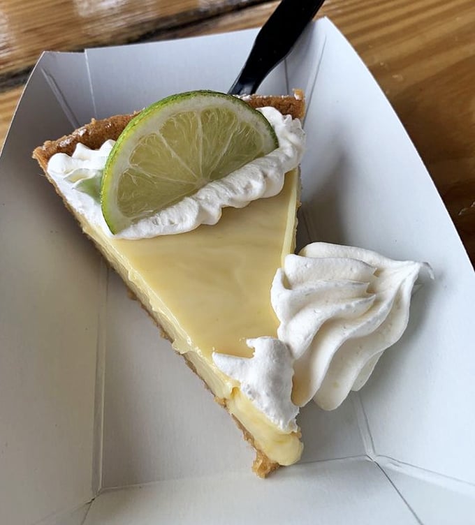 Sweet, tart, and utterly Floridian. This slice of key lime pie delivers the perfect balance of creamy, tangy, and sweet—Florida's signature dessert.