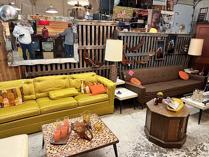 The living room section could furnish the perfect 1960s sitcom set—complete with wood paneling and enough seating for the whole Brady Bunch.